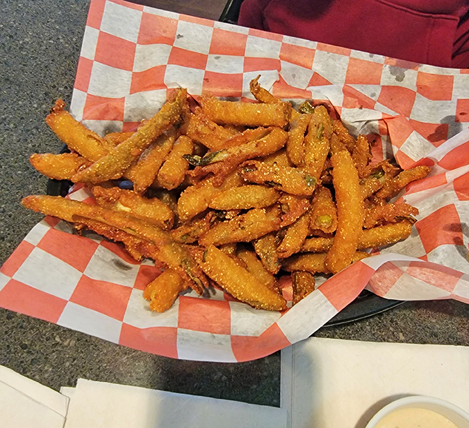 Sweet potato fries that achieve the impossible: crispy exterior, fluffy interior, and enough seasoning to make you forget vegetables were ever boring.