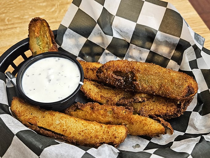 Fried pickles: the unsung heroes of appetizers. Crispy, tangy soldiers of satisfaction with a ranch dip that doesn't mess around. 