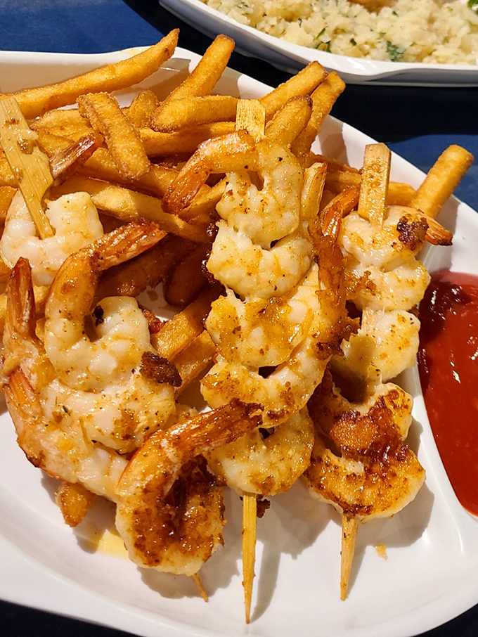 Plump, perfectly grilled shrimp that taste like they jumped from ocean to plate, nestled among fries that deserve their own fan club.