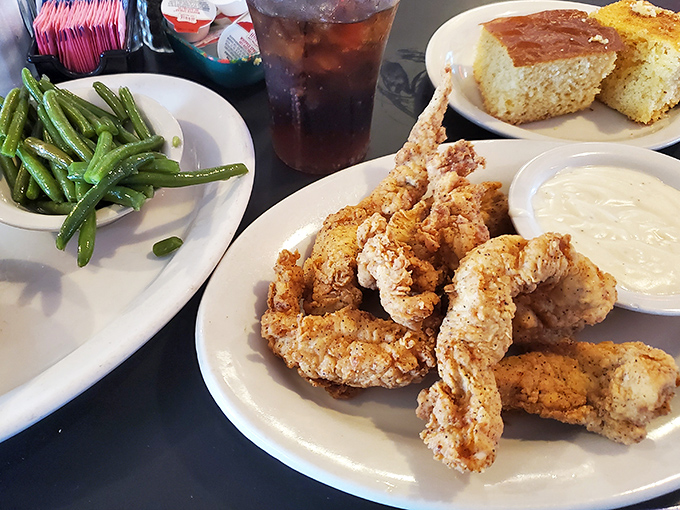 These golden-fried shrimp with crisp green beans and cornbread could make a seafood skeptic reconsider their life choices.