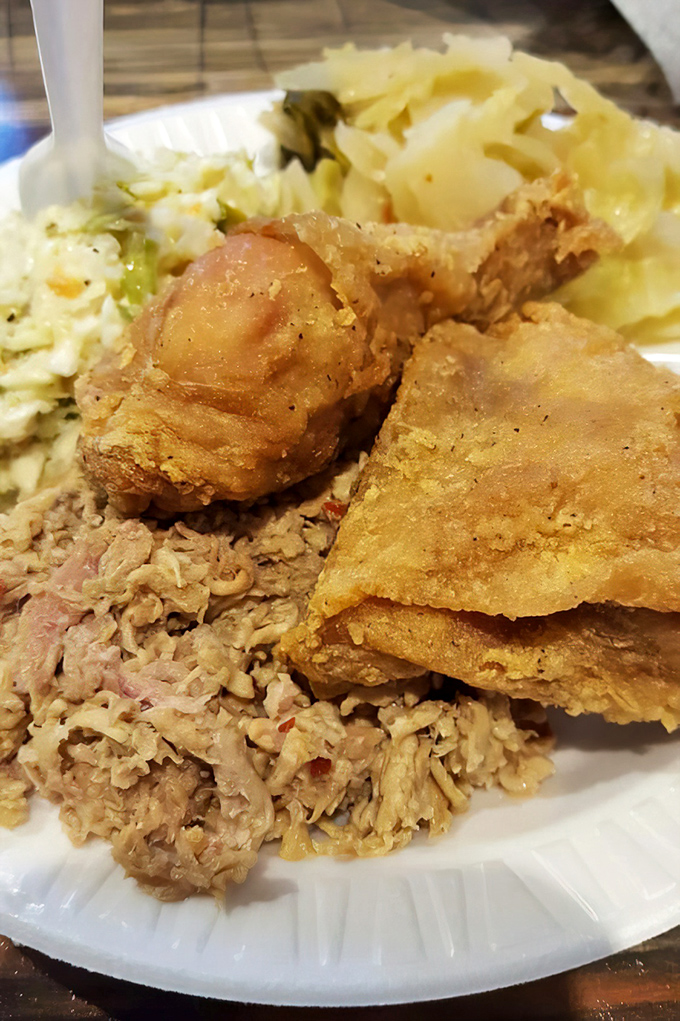 Fried chicken so perfectly golden it deserves its own trophy. Paired with that chopped pork, it's the ultimate Southern power couple.