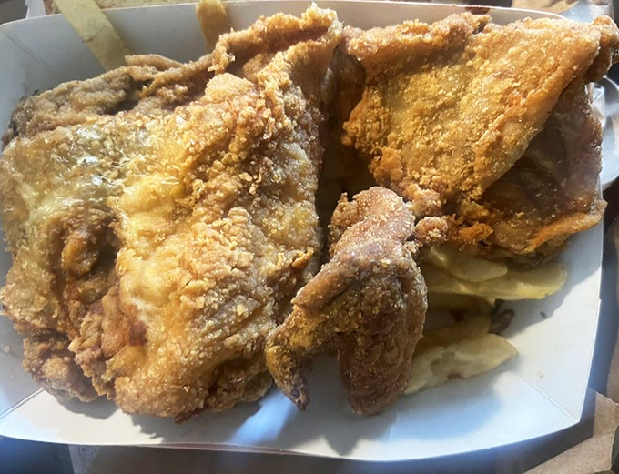 Golden-fried chicken that crackles with each bite, proving Lem's mastery extends beyond the smoker to the fryer.