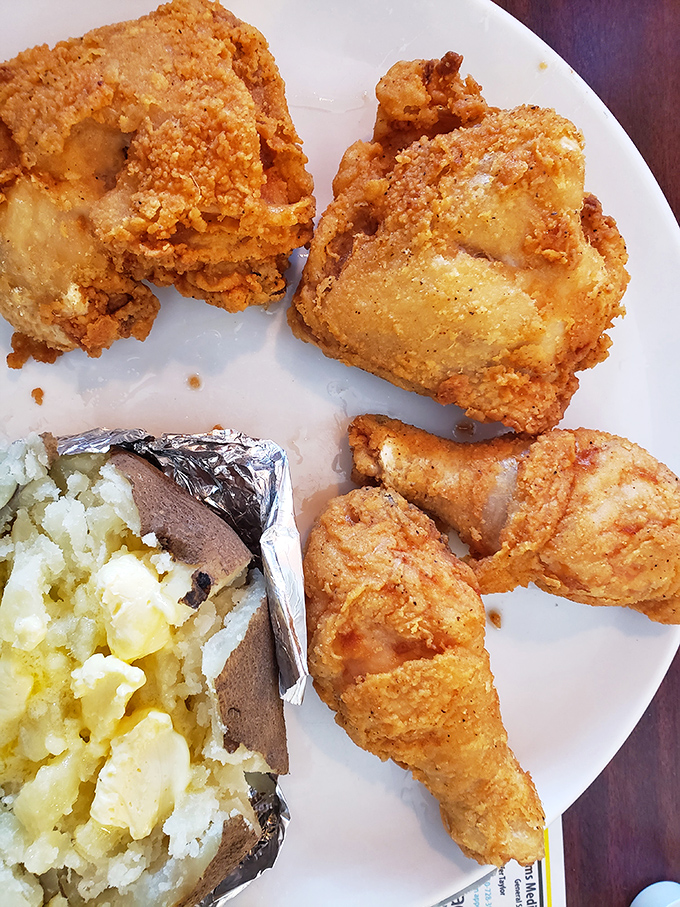 Fried chicken that would make your grandmother both proud and jealous, alongside a baked potato wrapped like the precious gift it is.