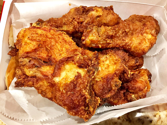 Box of joy: perfectly fried chicken pieces with that signature golden-brown crust. The kind of takeout that makes you drive with one hand while sneaking pieces with the other.