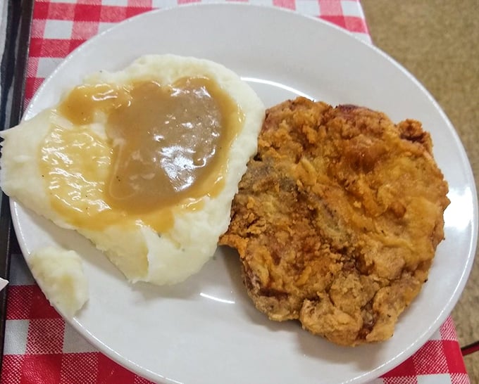 Country fried steak with gravy and mashed potatoes&mdash;the kind of plate that makes you want to hug the cook.