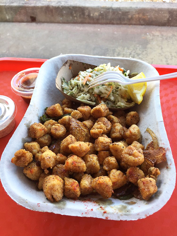 These fried scallops have achieved the impossible: a delicate crust that protects rather than overwhelms their sweet, oceanic essence.