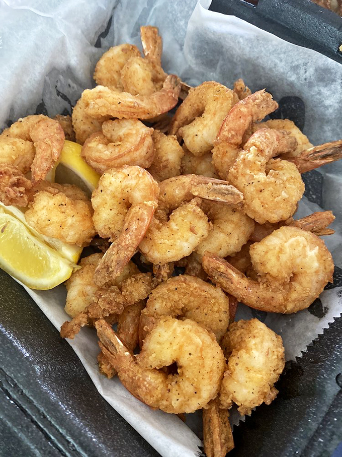 Golden-fried shrimp so perfectly crisp, they practically snap when you bite them. That lemon wedge isn't just garnish &ndash; it's essential equipment.