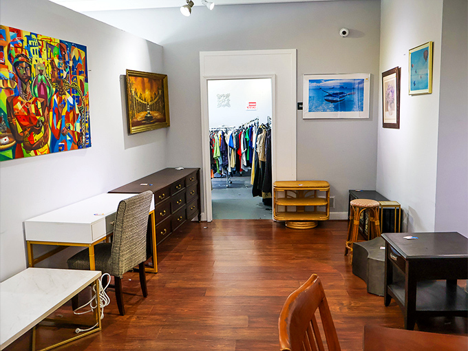 Mid-century furniture meets eclectic art in this corner where your next conversation piece is just waiting to be adopted.
