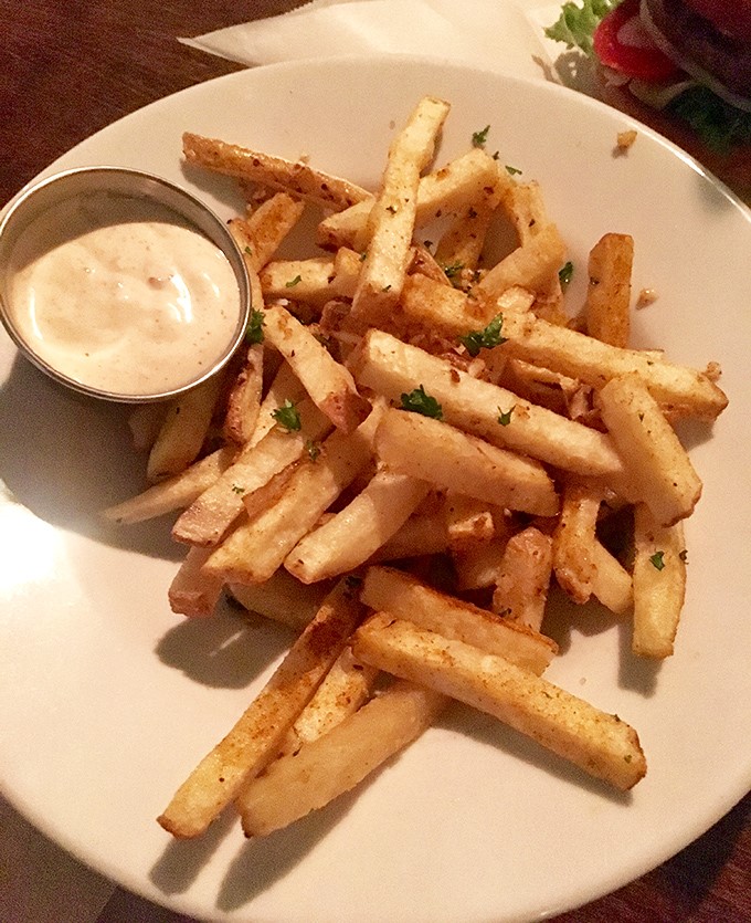 These hand-cut fries aren't just a side dish—they're a supporting actor worthy of their own spin-off series.