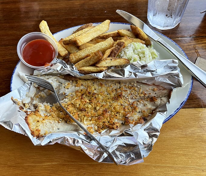 Parmesan-crusted whitefish that glistens like the lake at sunset. Served on foil because some treasures are too precious for ordinary plates.