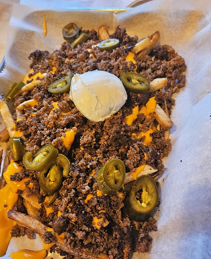 Ghetto Fries: where ground beef, molten cheese, jalape&ntilde;os and a dollop of sour cream transform humble potatoes into a dish worth fighting over.