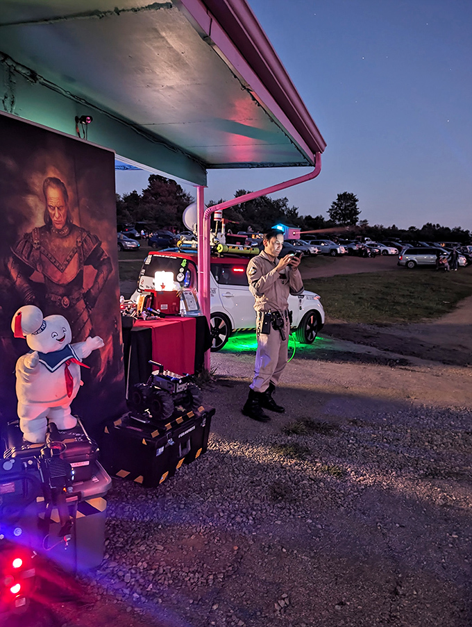 Where nostalgia meets modern entertainment&mdash;a costumed figure stands guard while patrons navigate between fantasy worlds and concession stands.