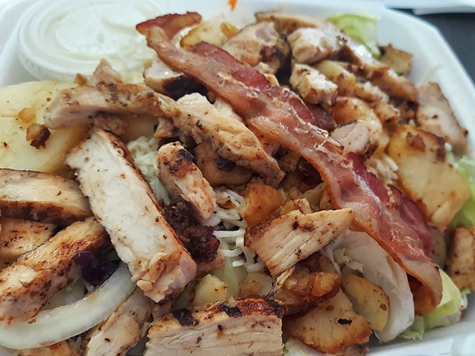 When a salad looks this good, even dedicated carnivores might pause&mdash;grilled chicken and crisp vegetables creating the illusion of healthy choices.