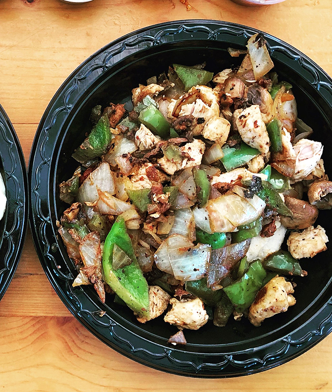 A fiesta in a bowl! Tender chicken mingles with vibrant peppers and onions in this colorful medley of Mexican comfort.