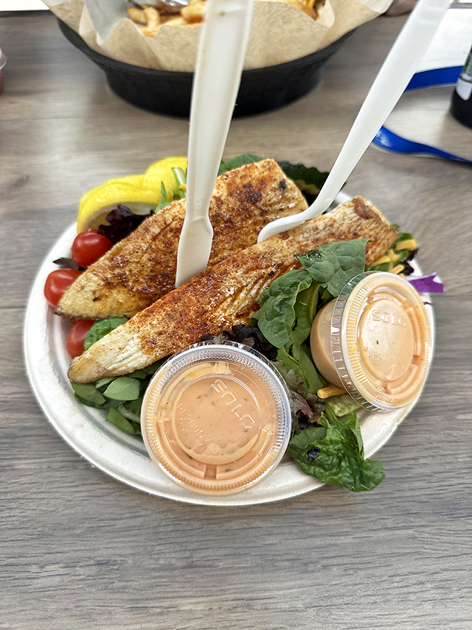 The grilled fish salad offers a lighter option that doesn't sacrifice flavor, proving that sometimes the healthier choice can be the tastier one too.