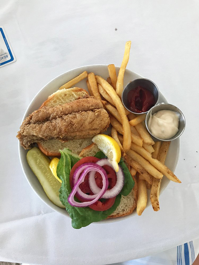 Behold the grouper sandwich that's converting fish skeptics into believers, one perfect bite at a time.