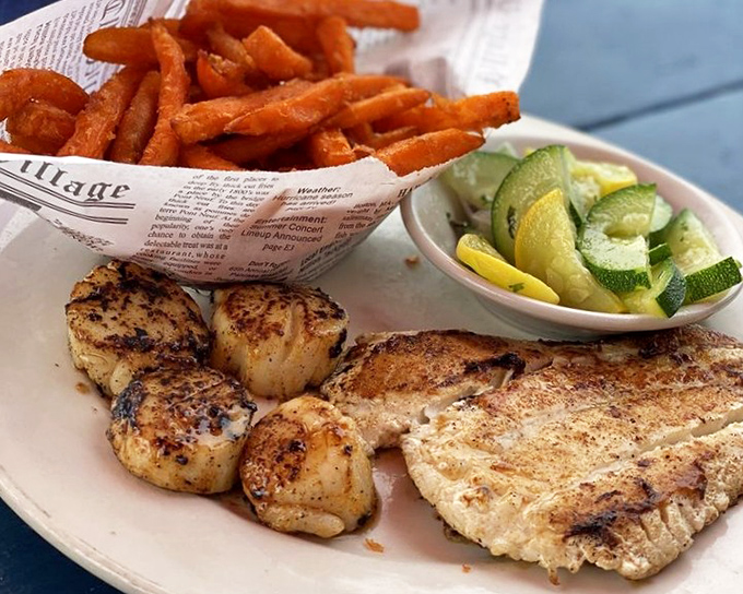 Perfectly grilled grouper meets sweet potato fries – proof that sometimes the simplest preparations let Florida's seafood shine brightest.