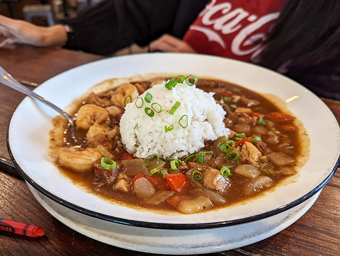 Gumbo that would make New Orleans jealous, with a perfect mound of rice standing like an island in a sea of flavor. Spoons up, napkins ready.