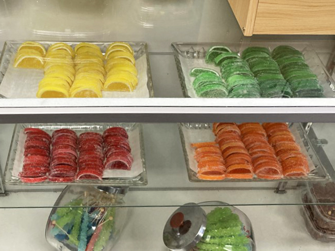 A rainbow of fruit slices that would make even Willy Wonka stop and take notes. Technicolor treats arranged with military precision.