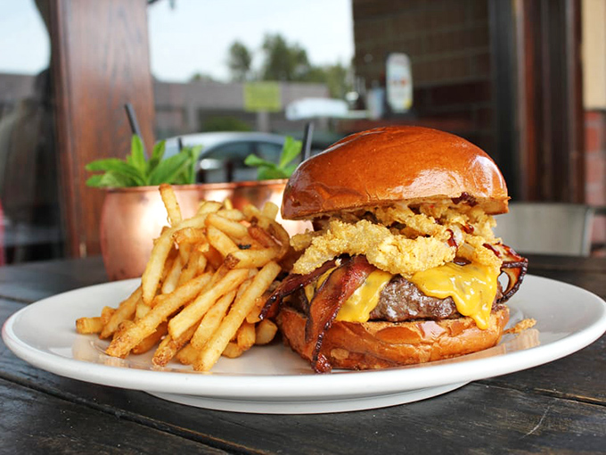 This isn't just a burger &ndash; it's an engineering marvel of beef, cheese, bacon, and those glorious onion strings. Napkins required, regrets impossible.