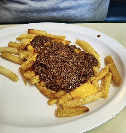 Chili cheese fries that don't care about your diet plans. The melted cheese and savory chili create a partnership more harmonious than most musical duos.