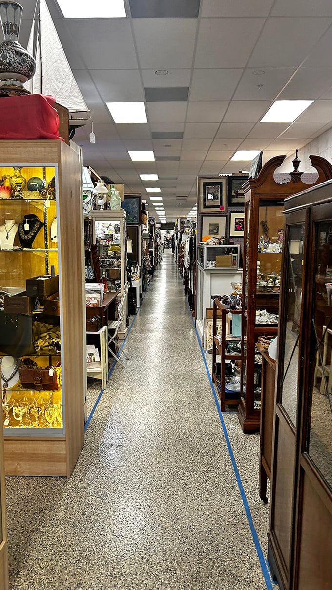 Infinity in an aisle. The perspective stretches toward a vanishing point of endless possibilities, with treasures stacked floor to ceiling on both sides.