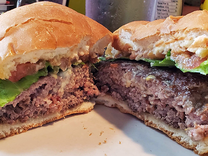 A burger cut in half reveals the truth&mdash;this isn't some fast-food imposter. It's the real deal, juicy and substantial, like a handshake from an old friend.