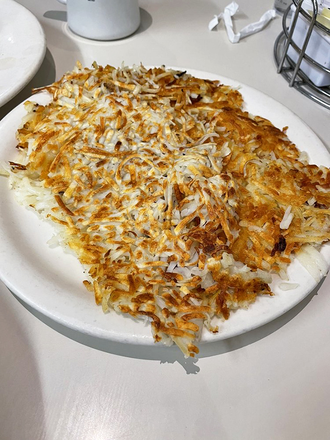 Hash browns that achieve the impossible trifecta: crispy edges, tender centers, and enough seasoning to make you forget ketchup exists.