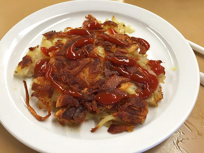 Hash browns that achieved what we all aspire to: the perfect balance of crispy exterior and tender interior, with a touch of ketchup artistry.