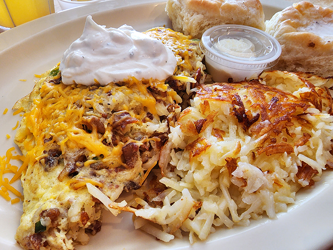 A proper breakfast skillet should be a beautiful mess of flavors. This one, topped with sour cream and melted cheese, is organized chaos at its most delicious.
