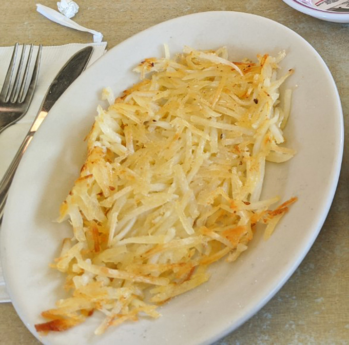 Hash browns that achieve the impossible balance &ndash; crispy exterior giving way to tender potato within. Simple perfection that requires no fancy technique.