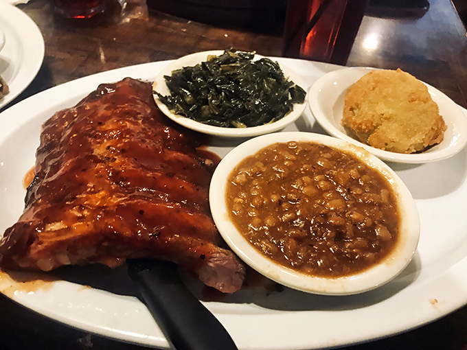 Barbecued ribs glistening with sauce alongside collard greens and beans &ndash; a holy trinity of Southern comfort that speaks to your soul.