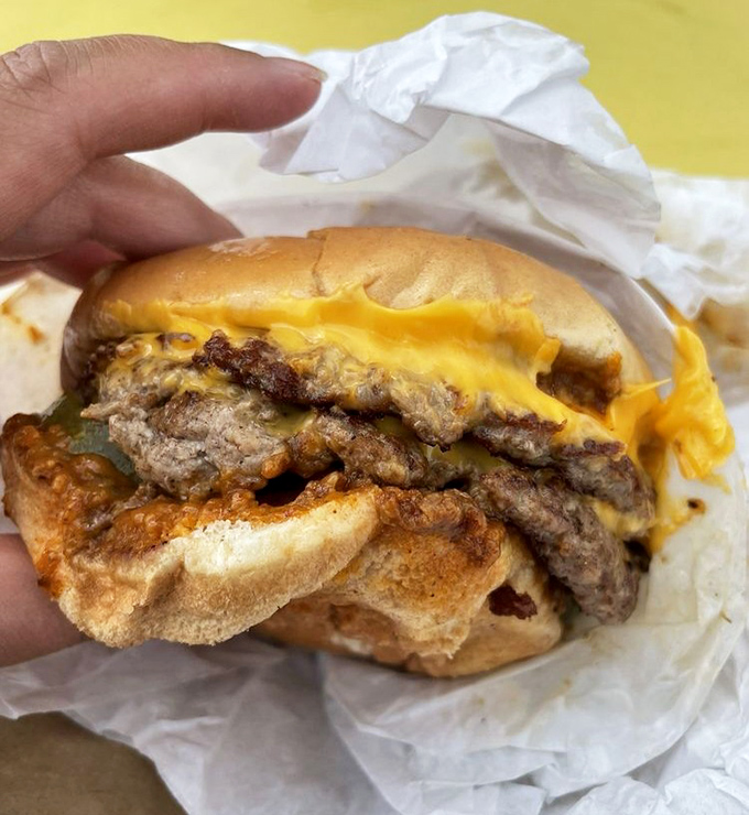 Behold the burger in its natural habitat&mdash;wrapped in paper, oozing cheese, and demanding to be devoured immediately. Resistance is futile.