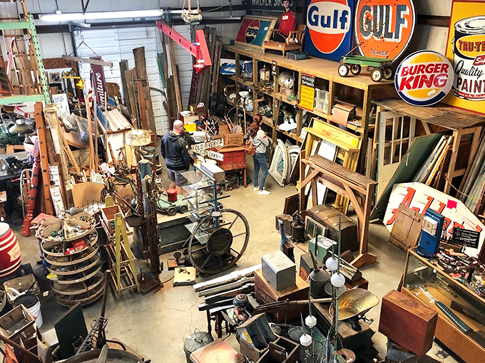 That farm table has hosted more Sunday dinners than your grandmother's kitchen, while vintage Coca-Cola signs remind us when soda was an event, not just a beverage.