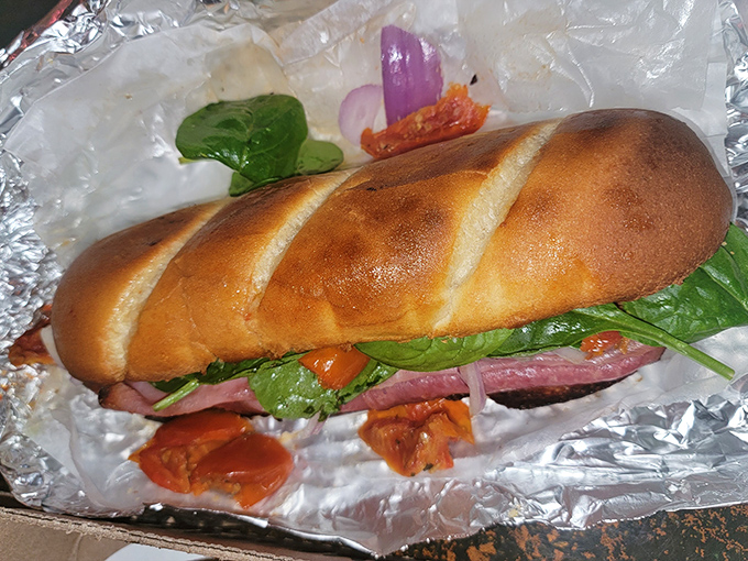 A sandwich that doesn't just satisfy hunger&mdash;it obliterates it. Fresh bread, vibrant veggies, and enough fillings to require an engineering degree to eat.