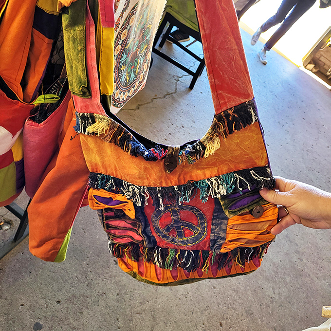 This vibrant peace-sign adorned bag isn't just an accessory &ndash; it's a time machine straight back to Woodstock with extra pockets for modern necessities.