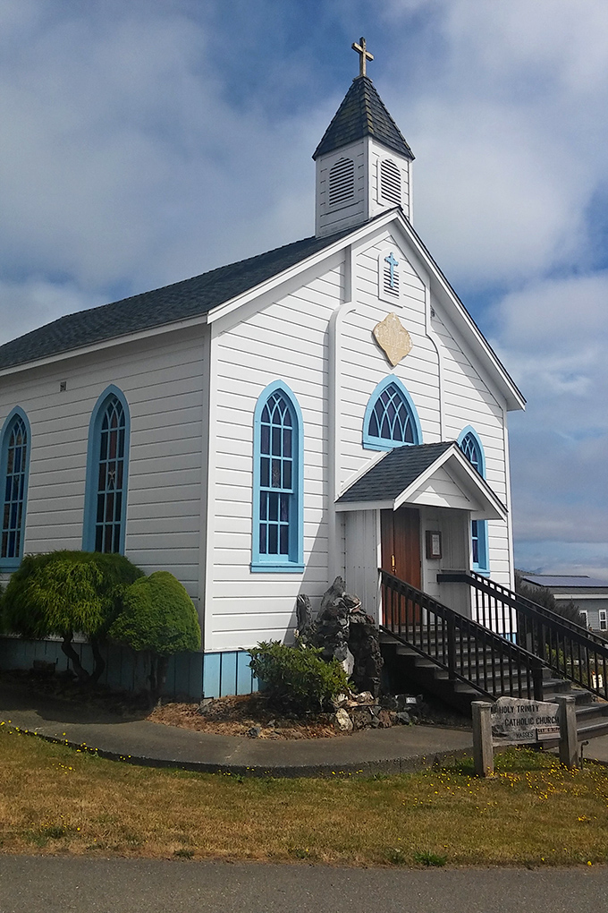 Holy Trinity Church's blue-trimmed windows and pristine white siding offer a spiritual anchor in a town where natural beauty already feels divine. 