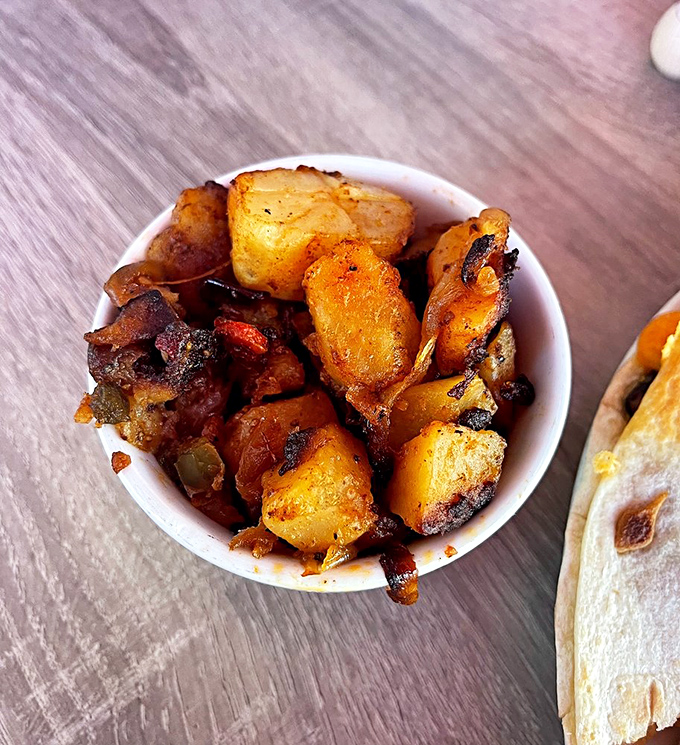Home fries that have clearly found their forever home&mdash;crispy, seasoned, and ready to steal the spotlight from whatever main dish they're supposed to accompany.