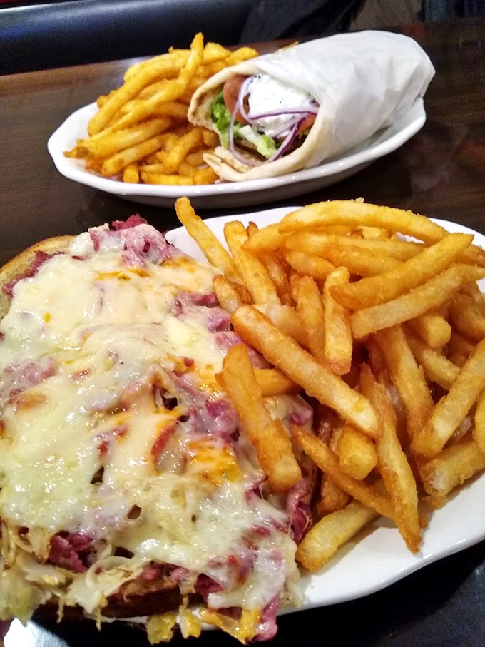A Reuben melt that would make Manhattan delis nervous, paired with fries that achieve the golden ratio of crispy exterior to fluffy interior.