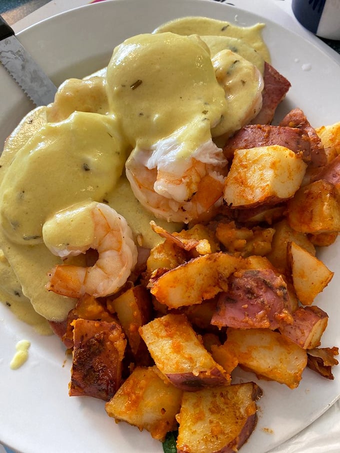 Eggs Benedict with plump shrimp and home fries that could make a potato farmer weep with pride. Hollandaise sauce should always be this luxurious.