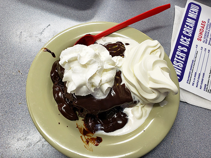 Hot fudge cascading over cake like chocolate lava, crowned with clouds of whipped cream. Dessert doesn't get more dramatically delicious than this.