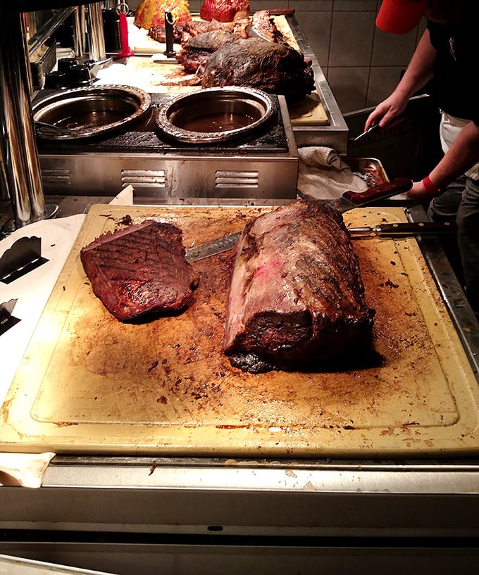 The carving station – where meat meets art. That brisket has clearly been having a long, meaningful conversation with smoke and spices.
