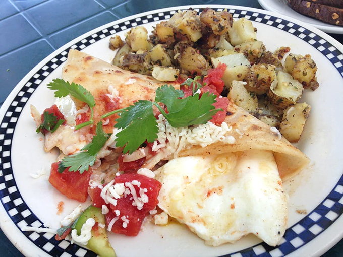 A breakfast burrito that doesn't need a passport to deliver authentic flavor. Those potatoes could make a carb-counter reconsider their life choices.