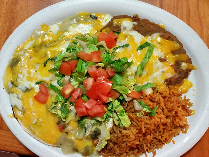 Huevos Rancheros that could unite nations. The melted cheese cascading over beans and eggs creates a diplomatic summit of flavors.