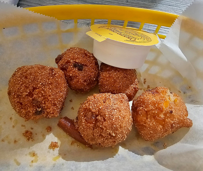 Golden-brown hush puppies that would make your Southern grandmother weep with joy. Crispy exterior, tender inside &ndash; the perfect seafood sidekick.