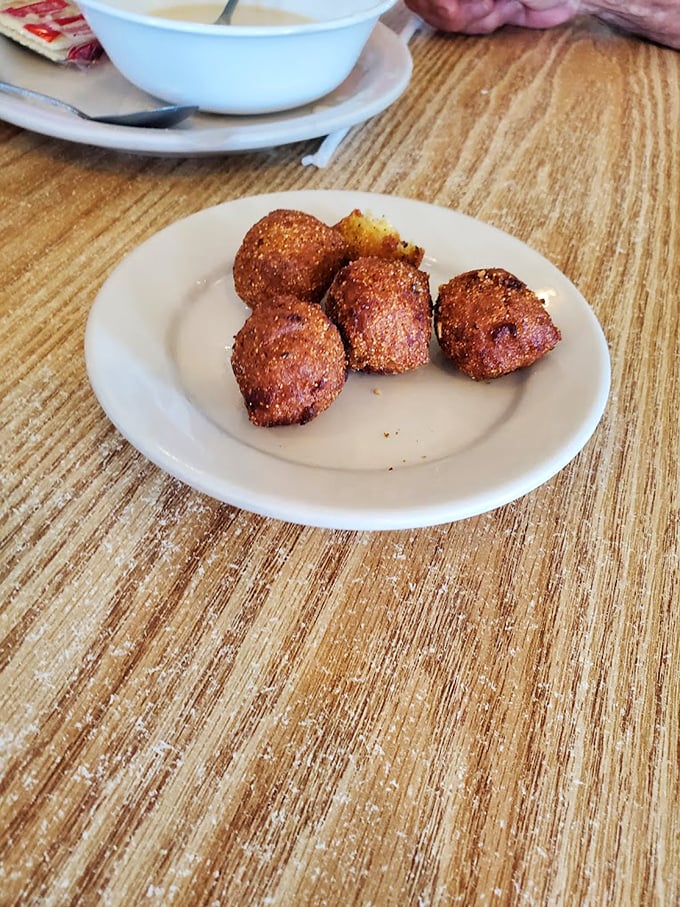 These hush puppies aren't telling tales, but they're speaking volumes about perfect frying technique&mdash;crisp exterior, tender cornmeal heart, and not a word of complaint.