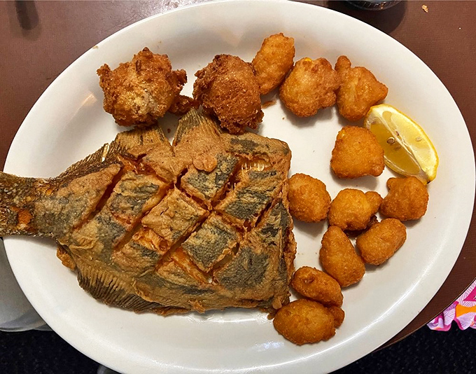 That whole fish staring back at you isn't judging your table manners&mdash;it's just surprised you found this hidden gem. The crispy skin hides tender, flaky perfection.