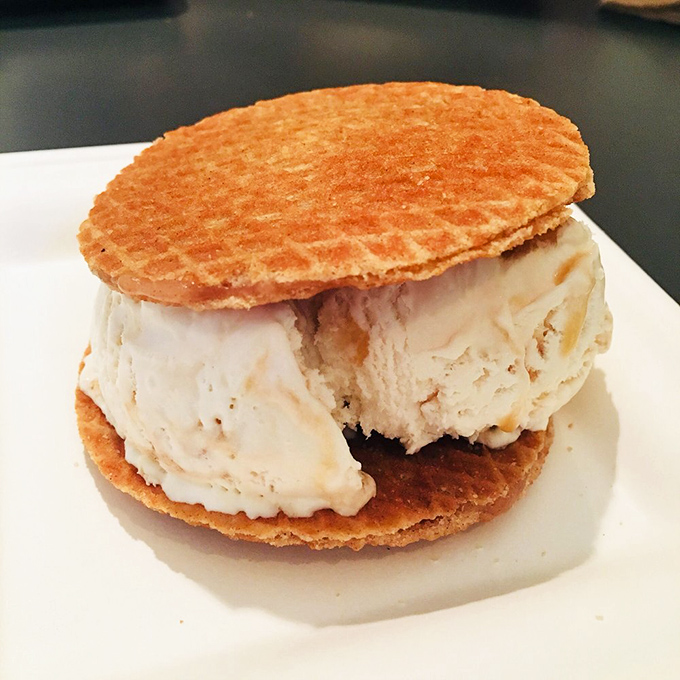 The humble ice cream sandwich reimagined&mdash;golden waffle discs embracing a generous scoop of creamy vanilla perfection.