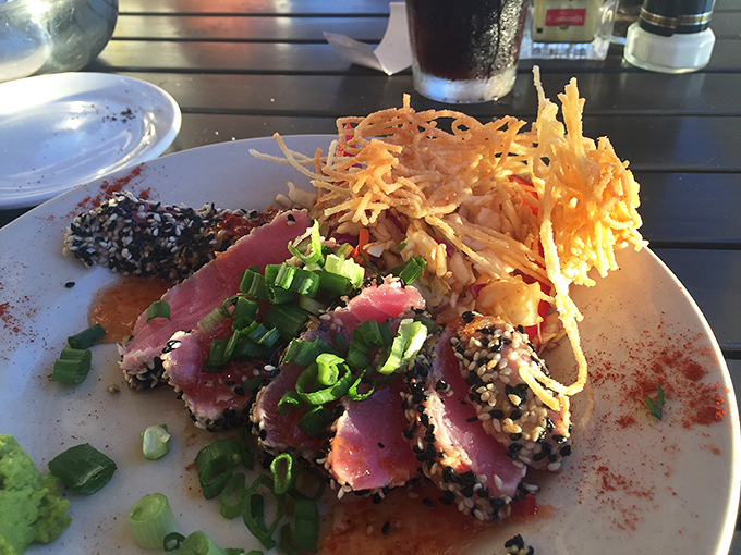 Sesame-crusted tuna that's living its best life&mdash;seared on the outside, blushing on the inside, with crispy garnish adding textural fireworks.