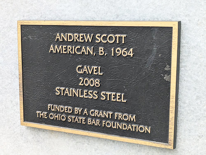 The artist's signature in metal. Andrew Scott's 2008 creation stands as proof that sometimes the most serious institutions have the most playful public art.